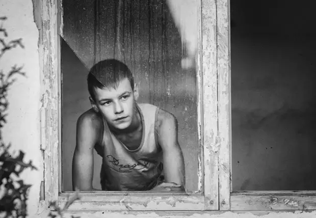 Boy in the window. Russian photographer Inna Sukhova.